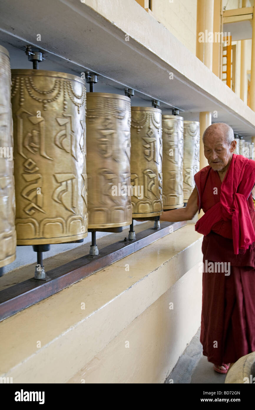 Buddhist monk turning the prayer wheels. Kalachakra Temple. McLeod Ganj ...
