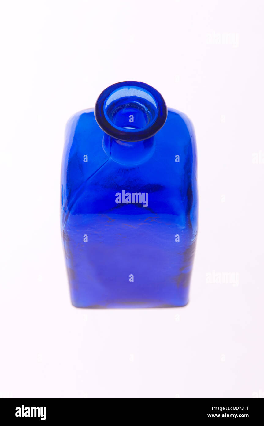 Blue glass bottle cutout against a white background Stock Photo - Alamy