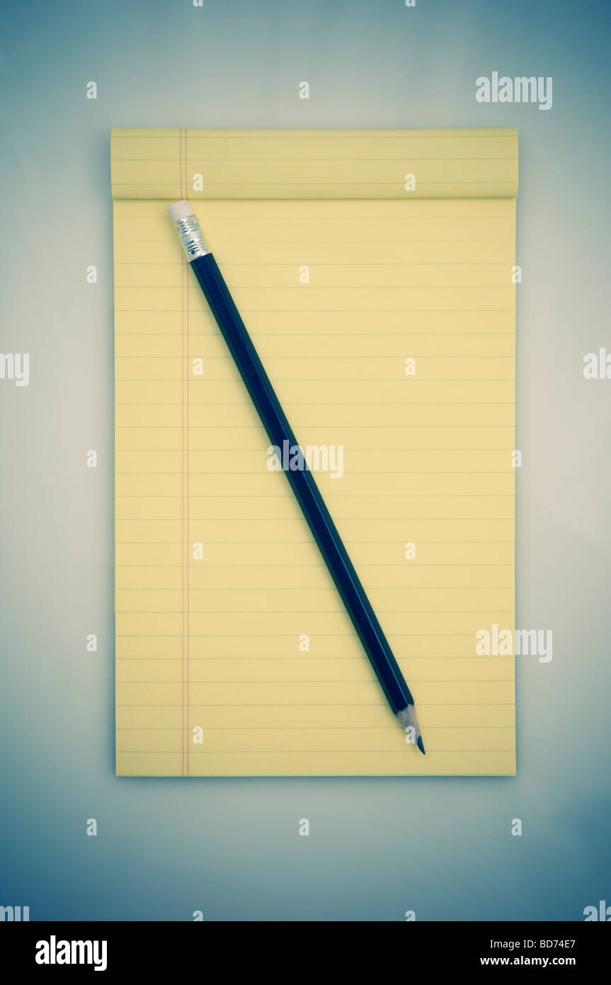Pencil and notepad Stock Photo - Alamy