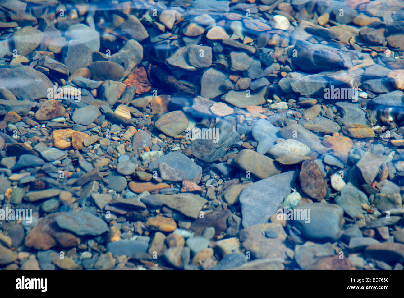 rocks through clear water Stock Photo - Alamy