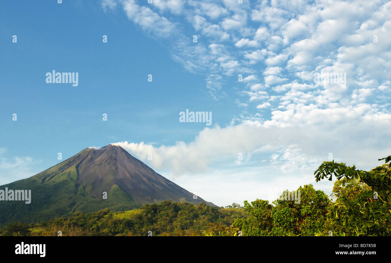 The large, active volcano's smoke plume leaves a visible train in the ...