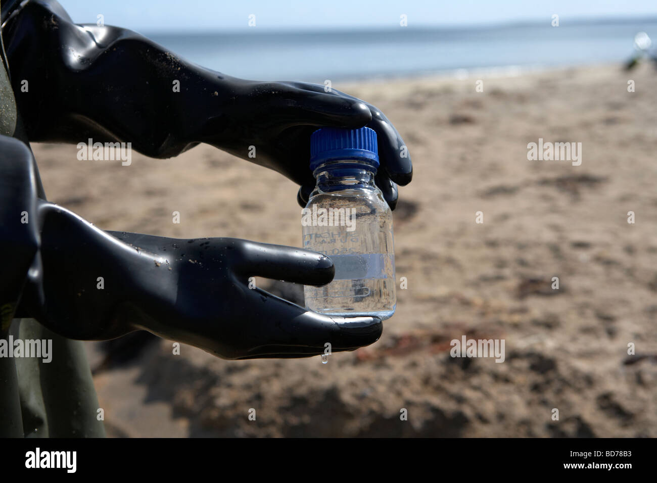 northern ireland environment service operative sampling water from ...