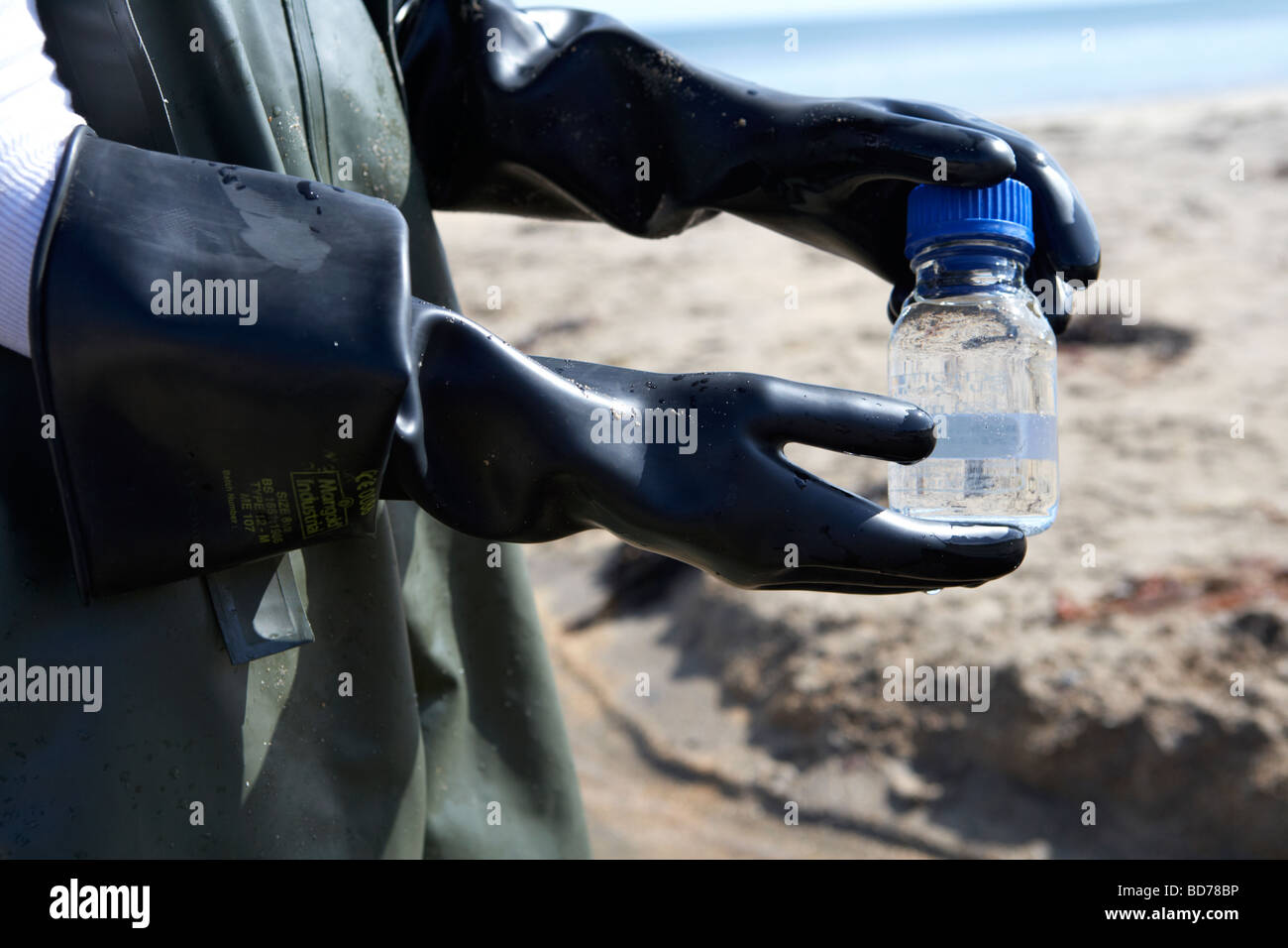 northern ireland environment service operative sampling water from ...