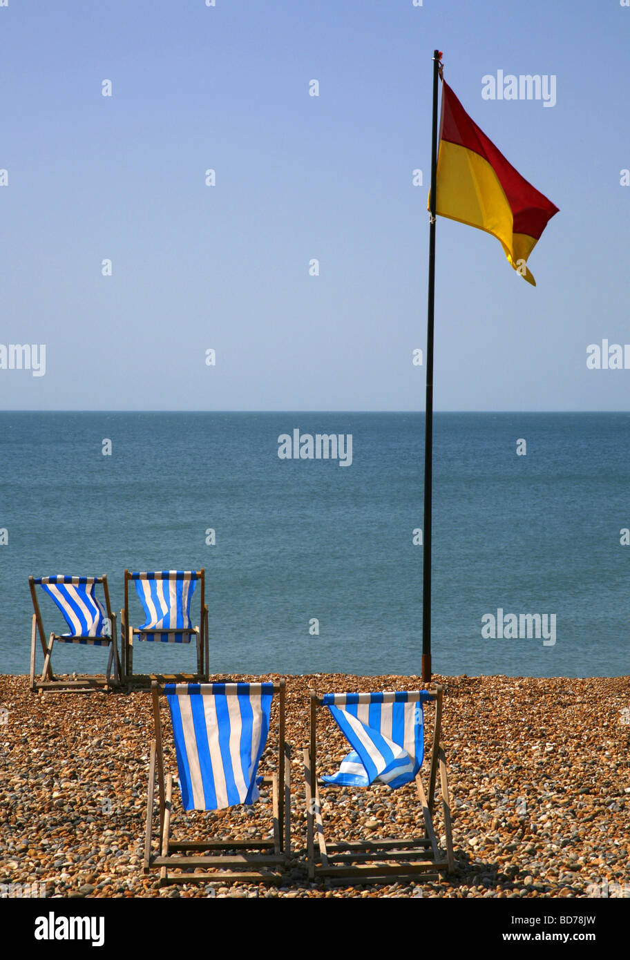 A safe bathing flag and deck chairs at Brighton, Sussex Stock Photo - Alamy