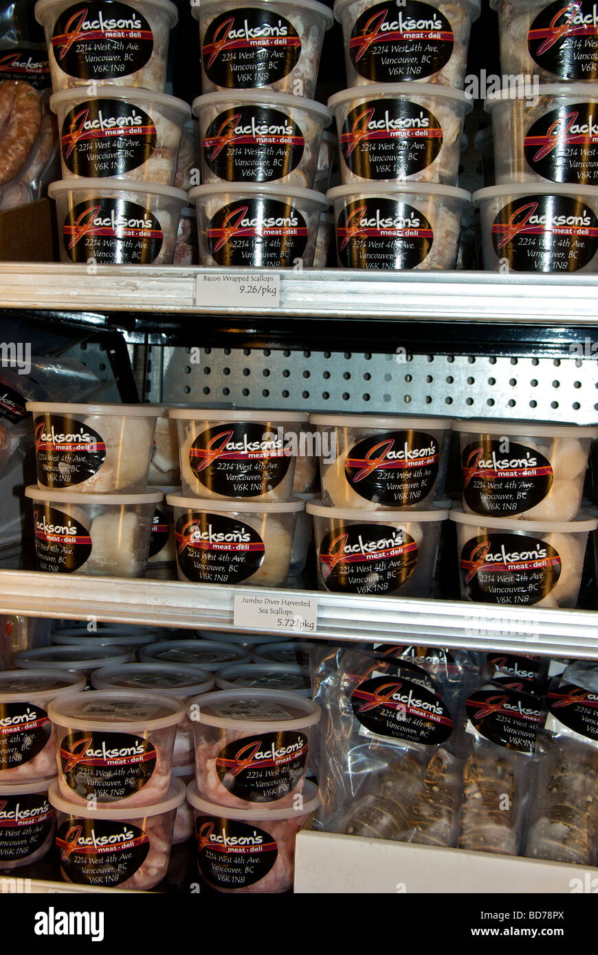 Specialty frozen seafood items in upright freezer display case Stock ...