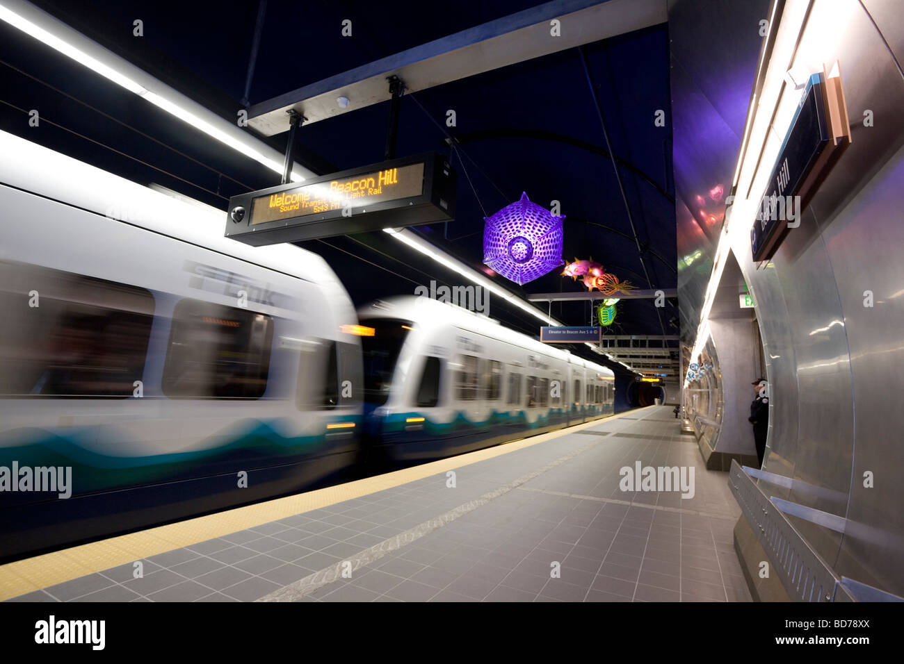 Security Guard Watching a Train Disembark at the Beacon Hill Station ...