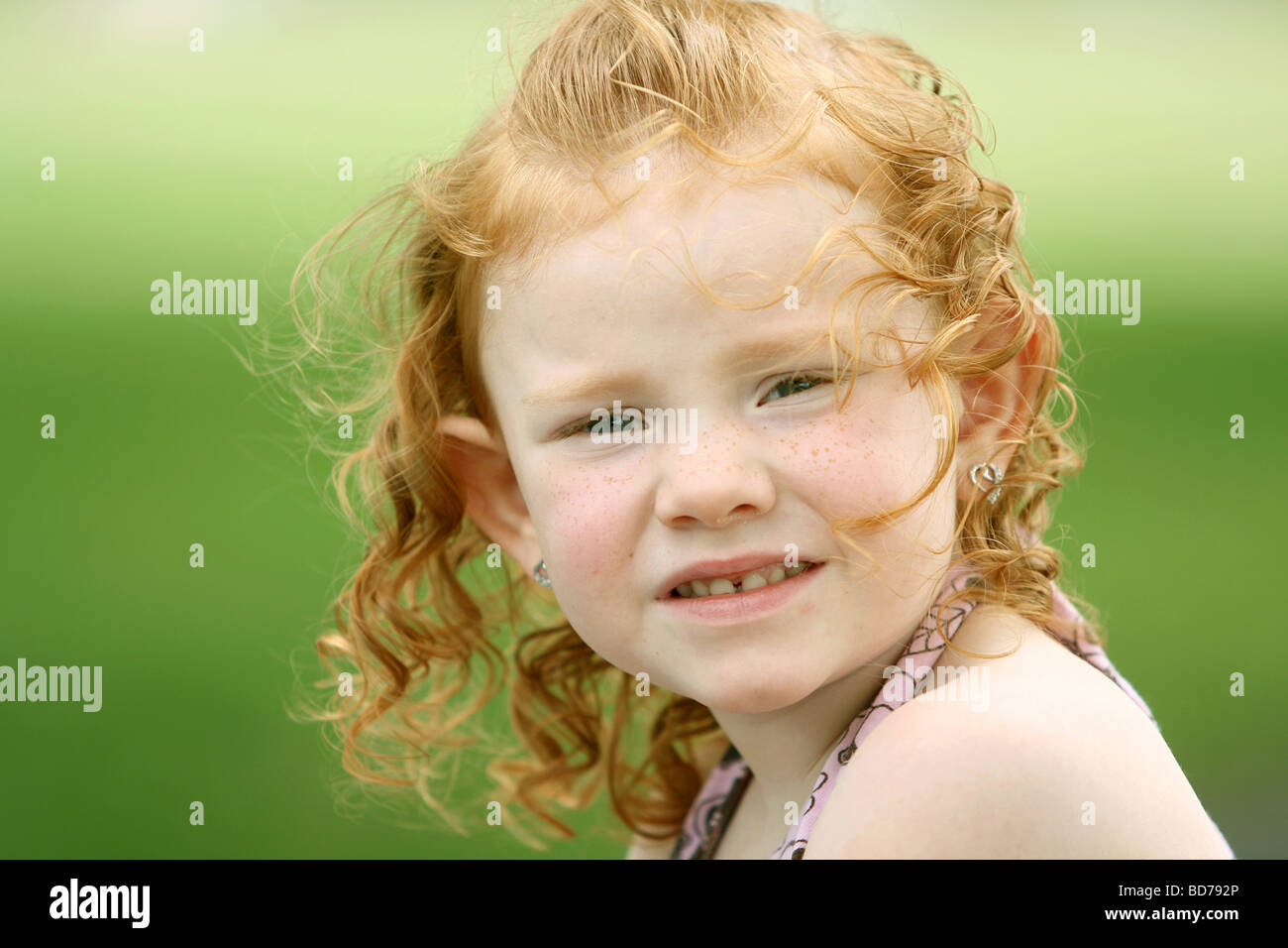 Close up of little girl, age 3 with curly red hair Stock Photo - Alamy