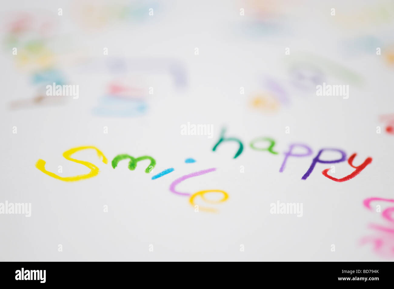 Coloured word smile, happy and love on paper written in colouring ...