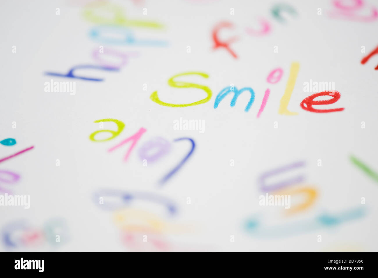 Coloured word smile, happy and love on paper written in colouring ...