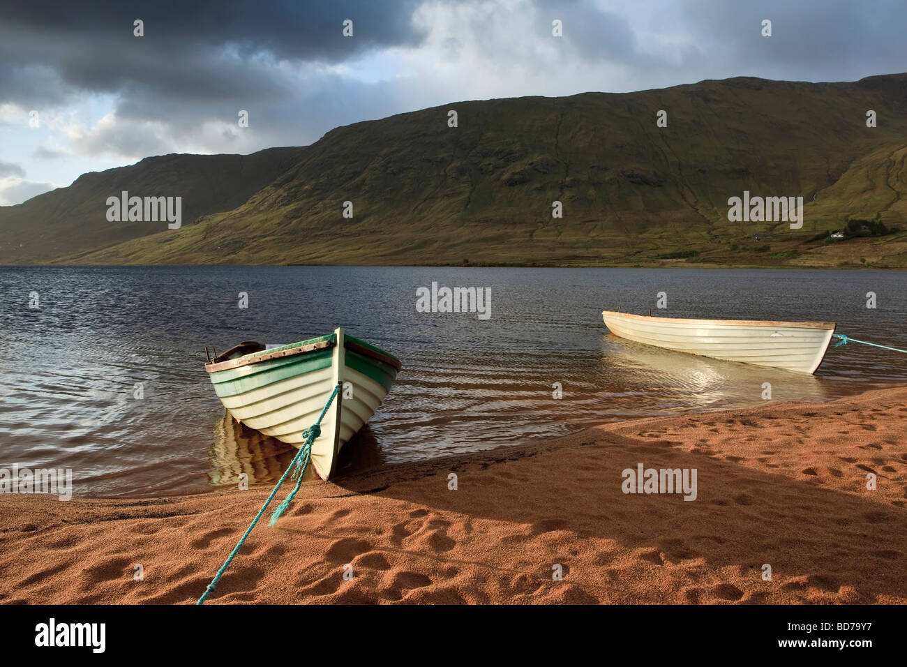 Two Rowing boat used for angling tied up on the banks of an Irish lake ...