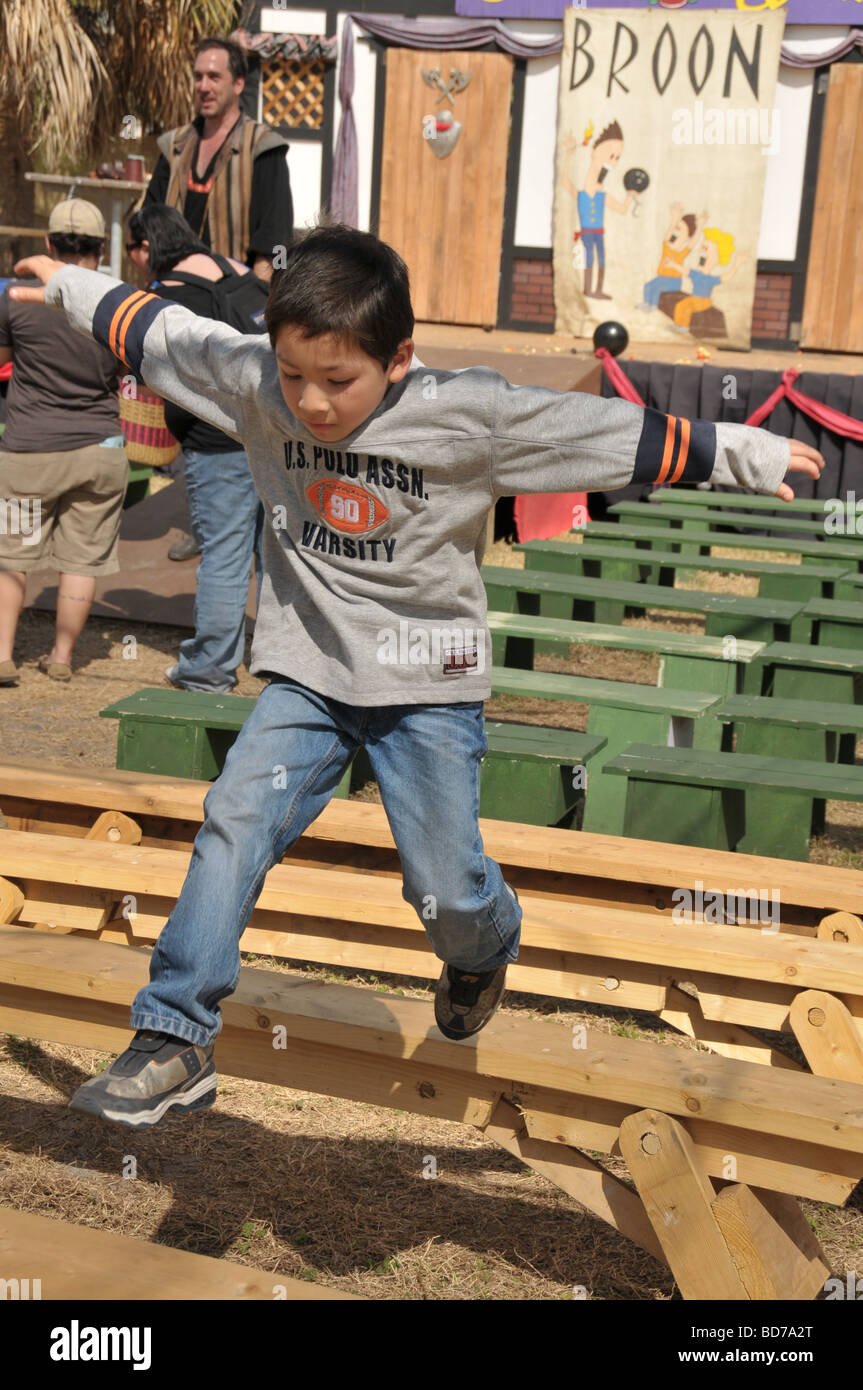 Boy jumping off bench Stock Photo - Alamy