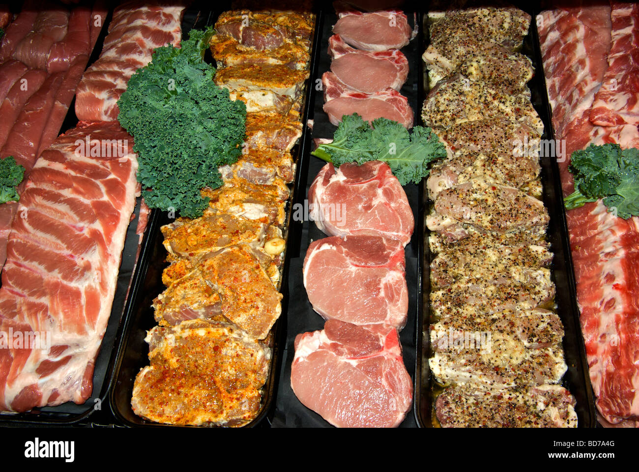 Meat display cooler case with raw uncooked pork products chops spare ...