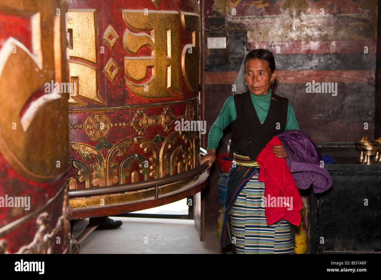 Bodhnath, Nepal. Tibetan Buddhist Worshiper Turning Prayer Wheel ...