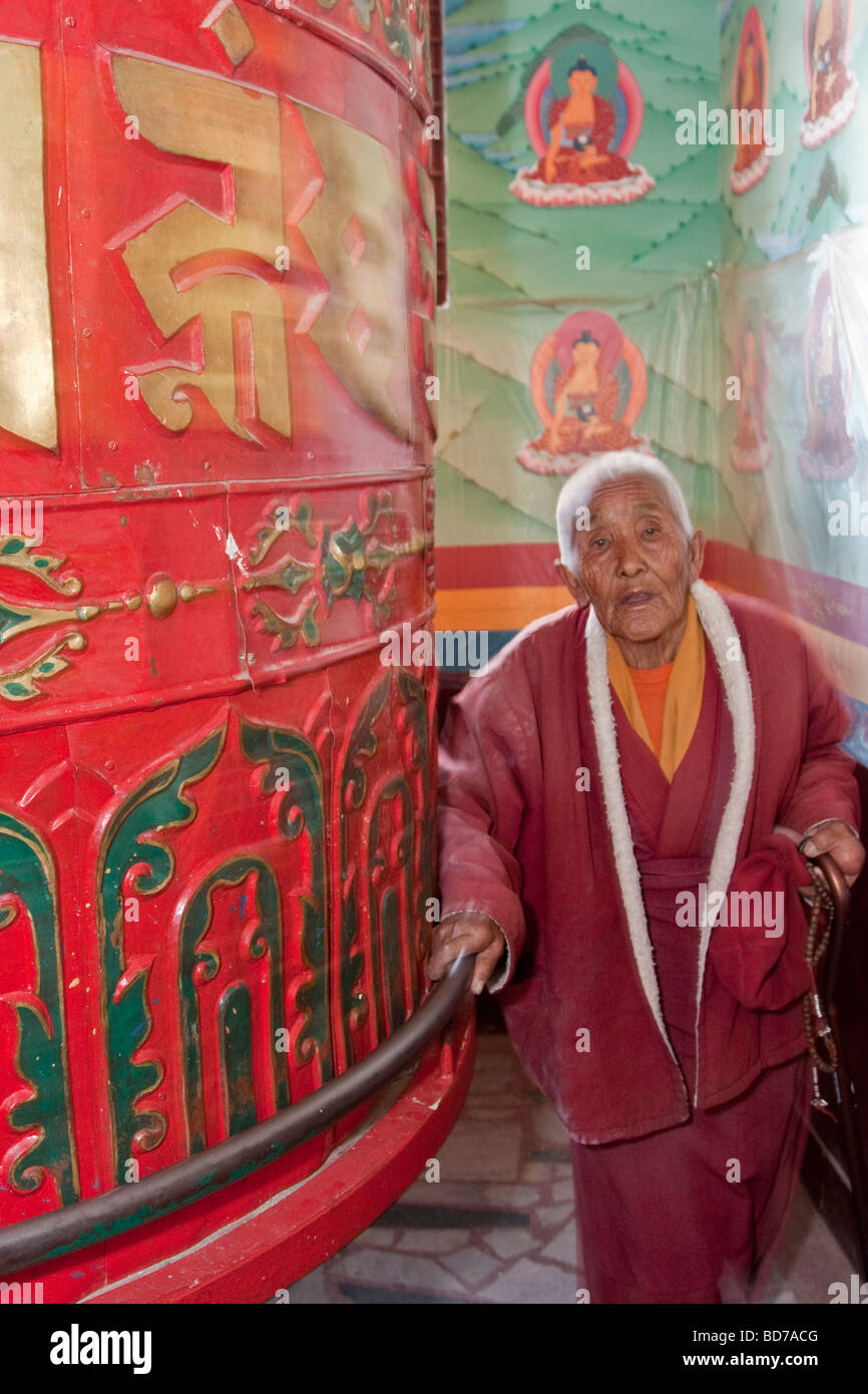 Bodhnath nepal buddhist worshiper turning hi-res stock photography and ...