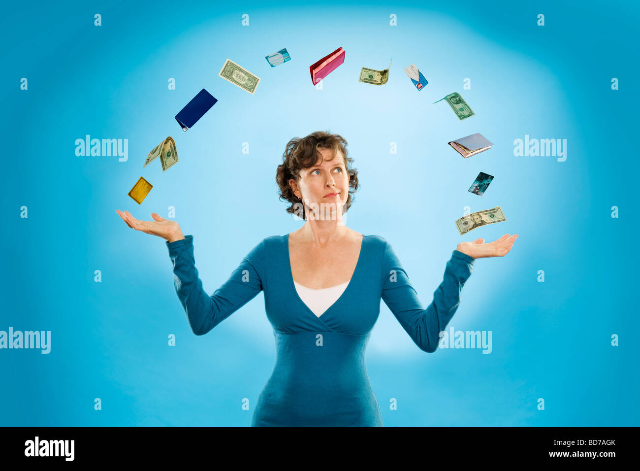 Woman juggling financial items Stock Photo - Alamy