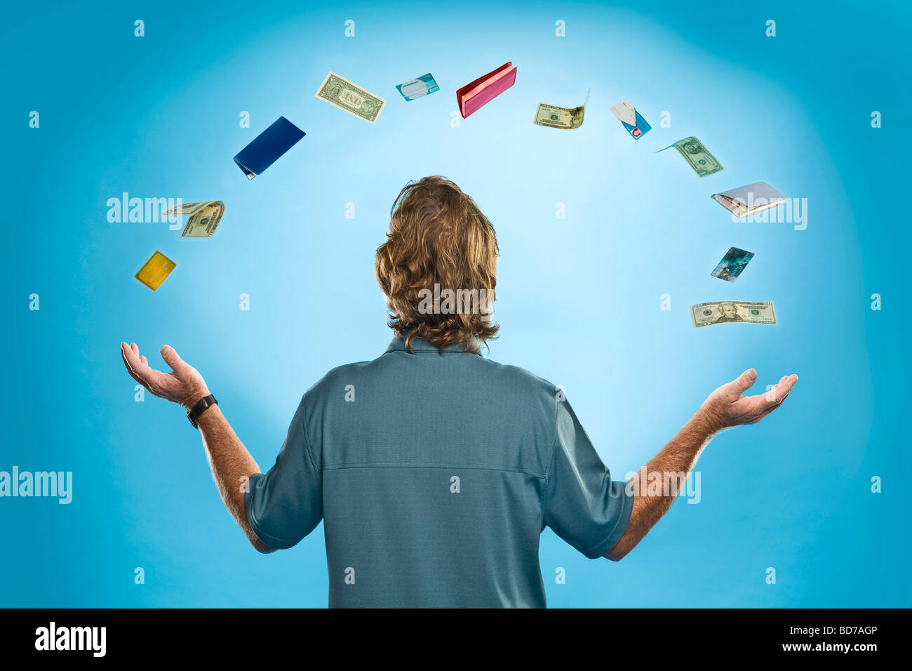 Man juggling financial items Stock Photo - Alamy