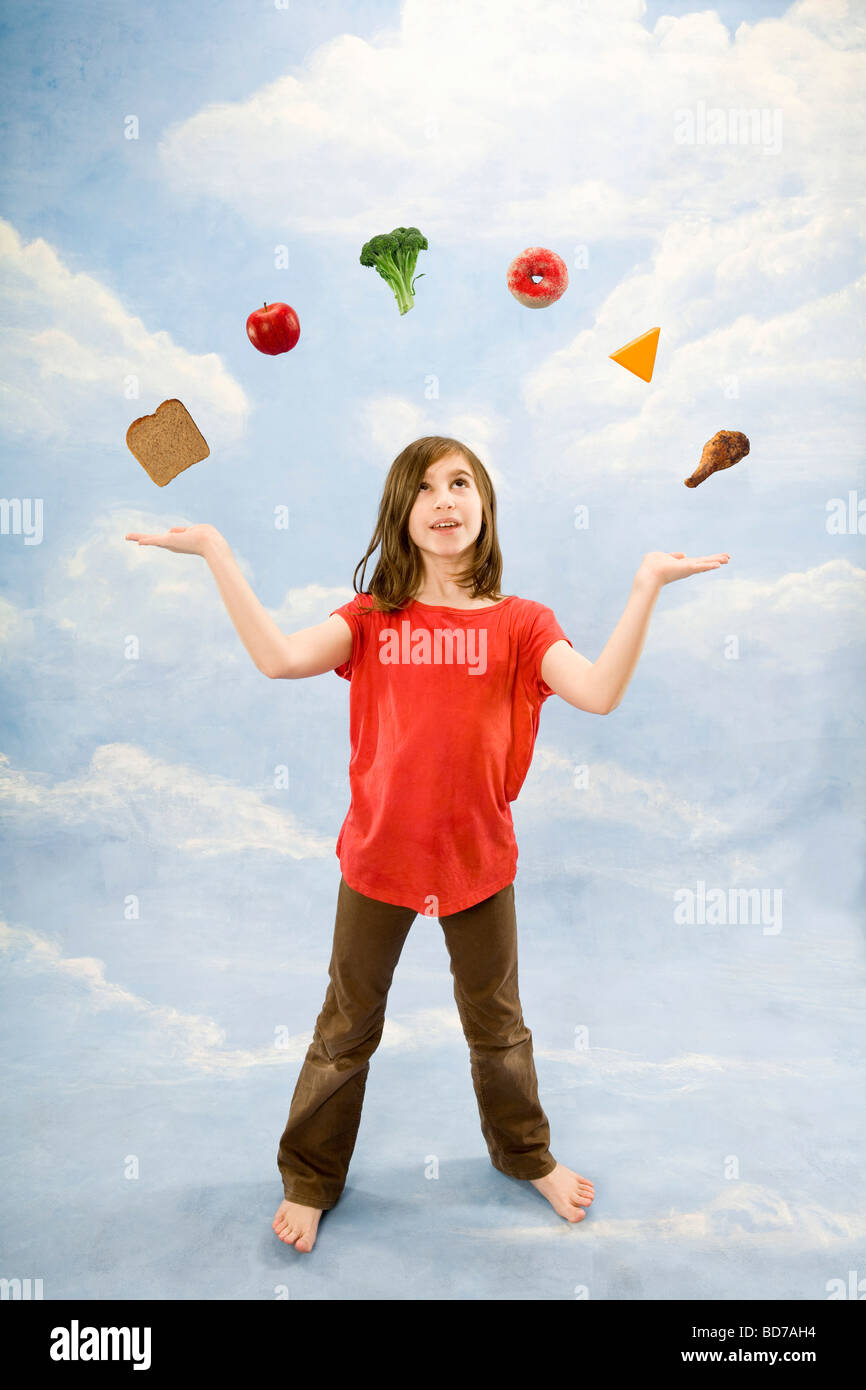 Child juggling different foods Stock Photo - Alamy
