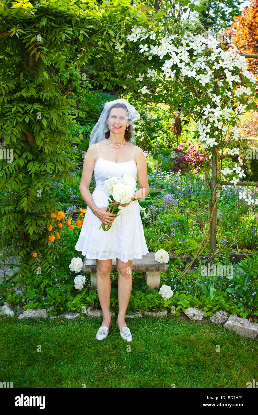 Bride in garden Stock Photo - Alamy