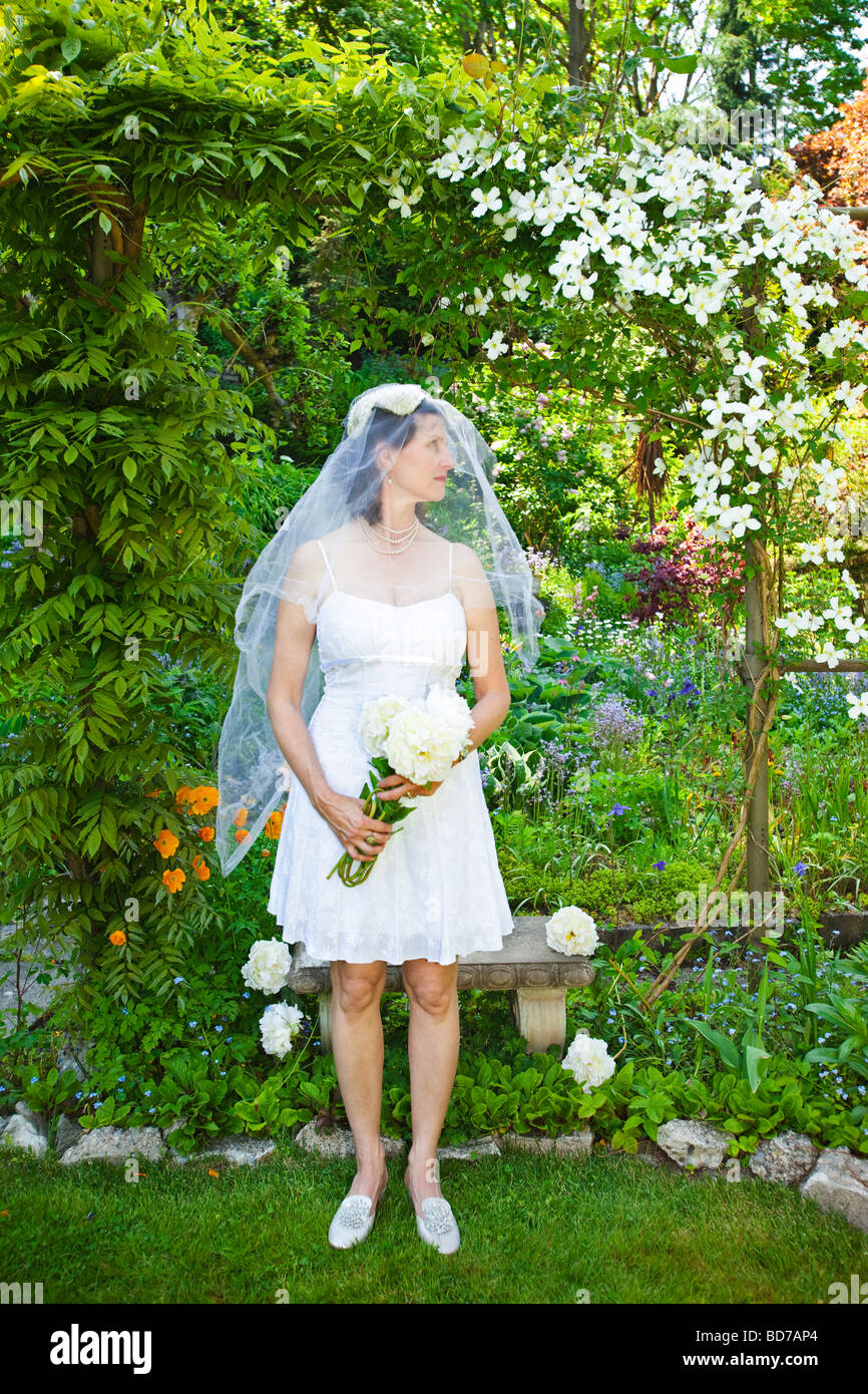 Bride in garden Stock Photo - Alamy