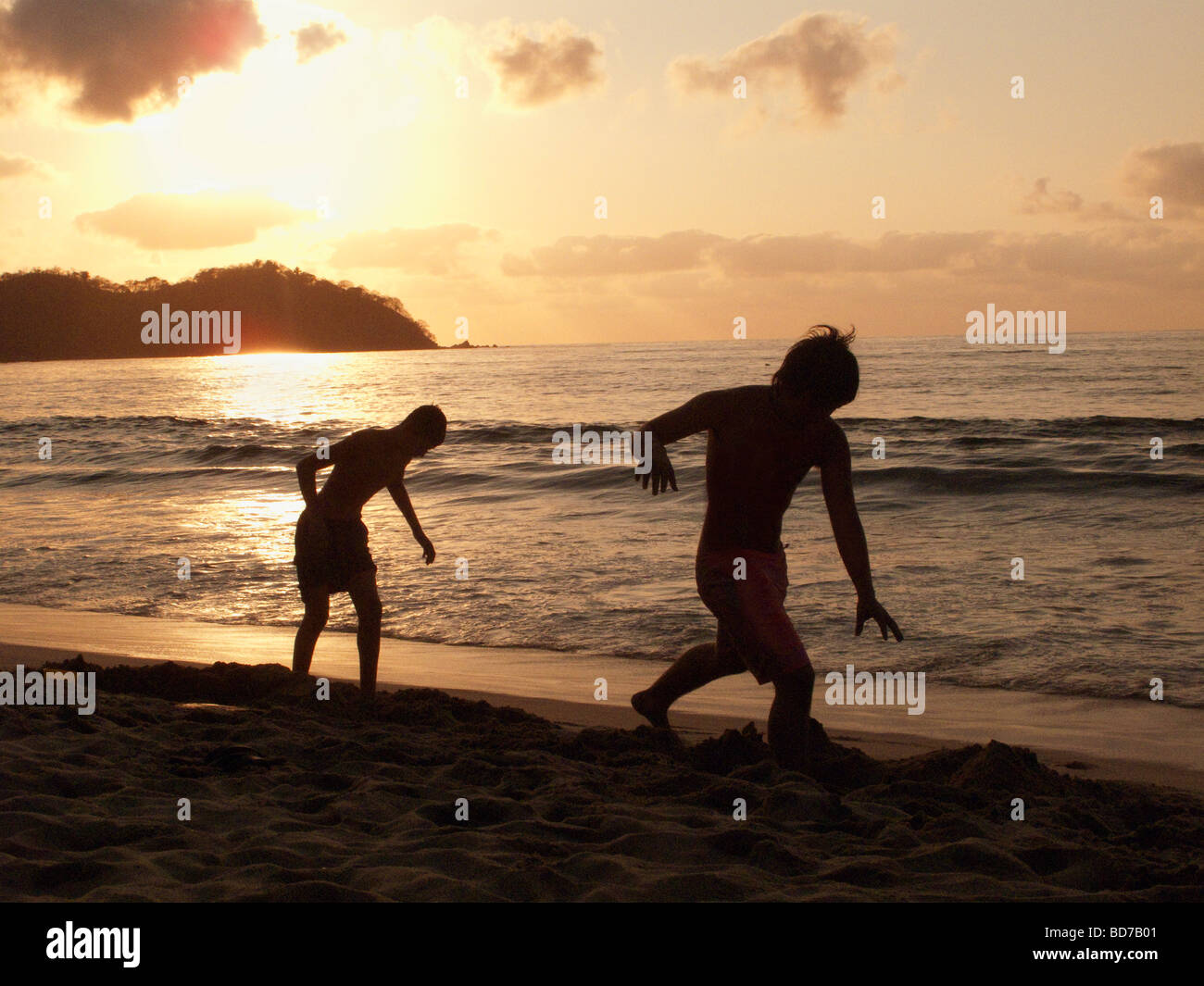 Two people on the beach Stock Photo - Alamy