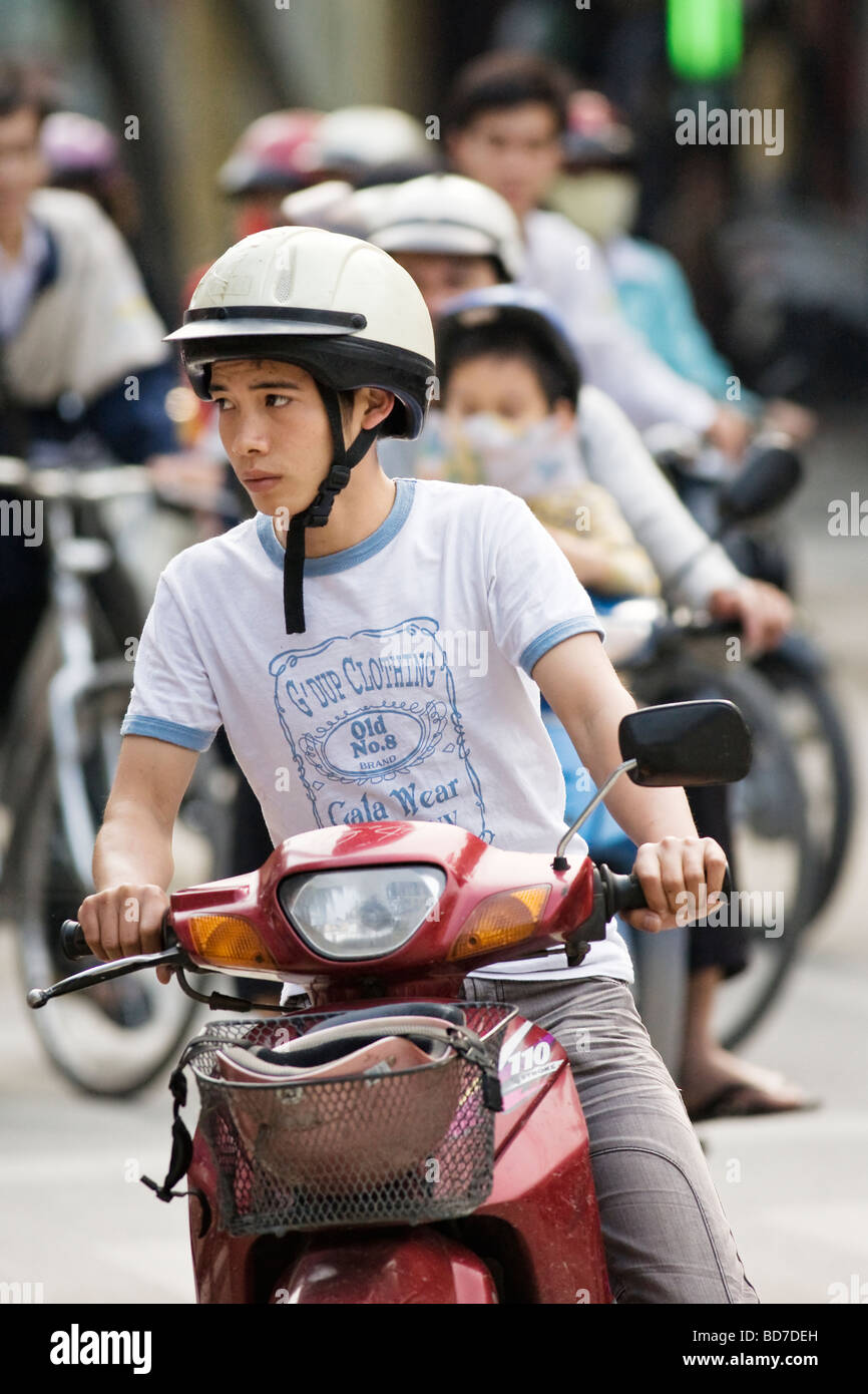 People riding scooters/mopeds in Vietnam in Hanoi Stock Photo - Alamy
