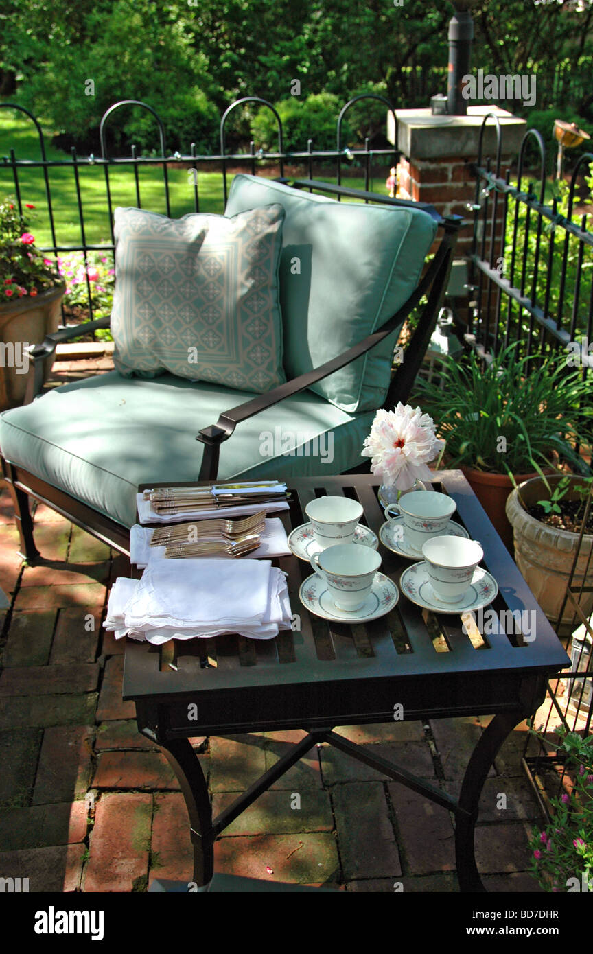 Outdoor patio with silverware and furniture during a sunny day Stock ...