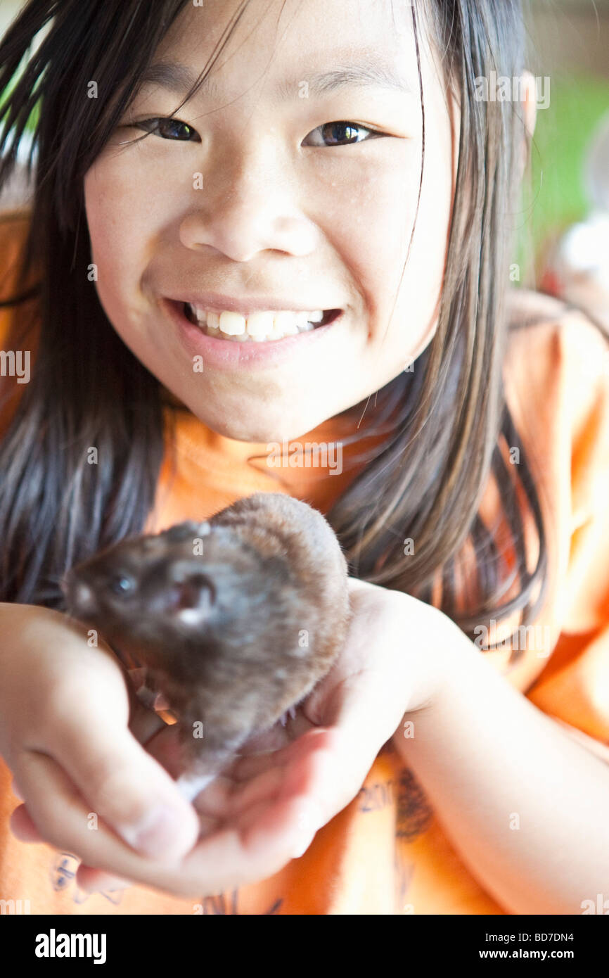 Girl holding pet rat Stock Photo - Alamy