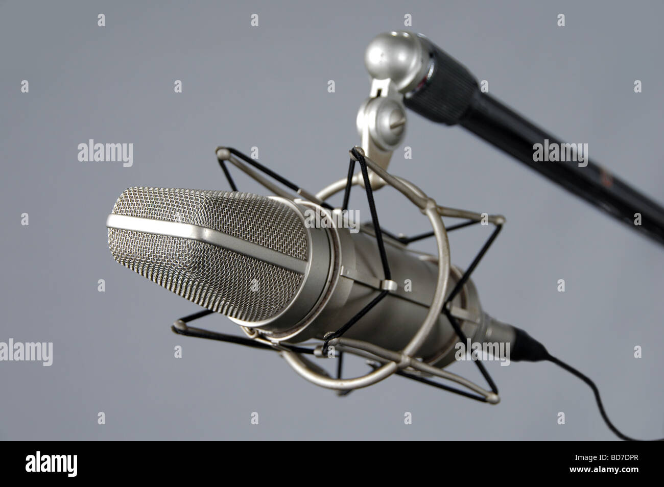 Vintage studio microphone with selective depth of field over a neutral ...