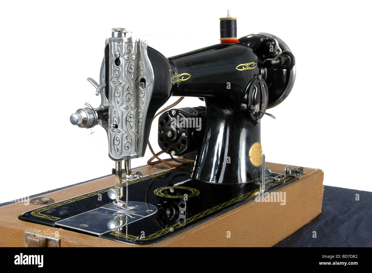 Vintage sewing machine isolated over a white background Stock Photo - Alamy