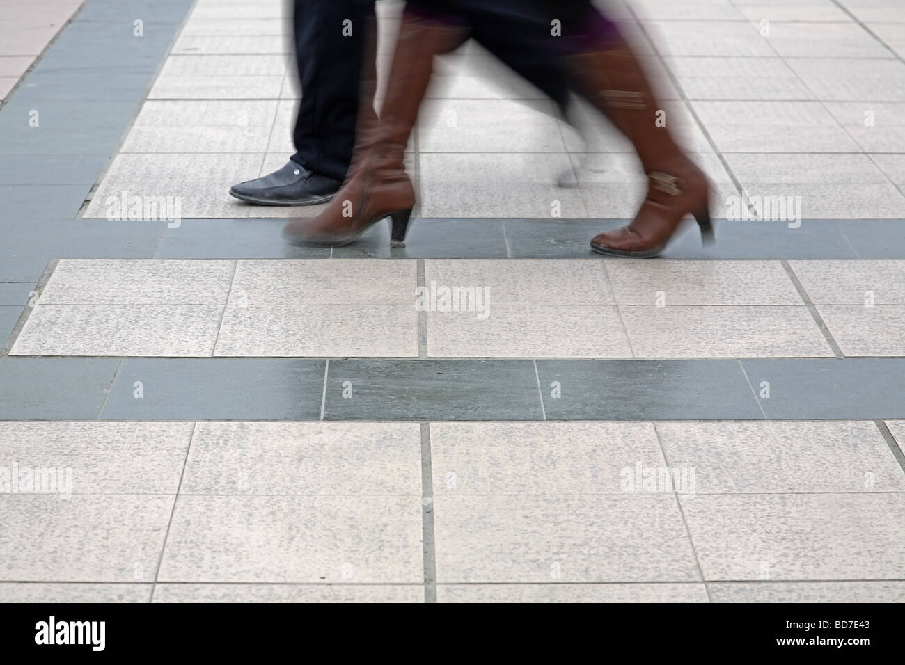 Blurred feet of walking people Stock Photo - Alamy