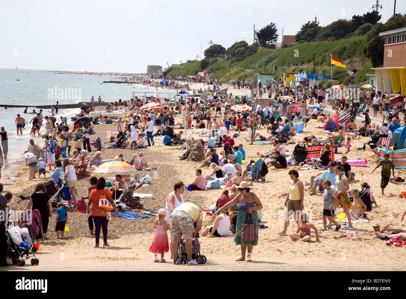 CROWDS OF PEOPLE ON THE BEACH AT CLACTON ON SEA ON THE ESSEX COAST ...
