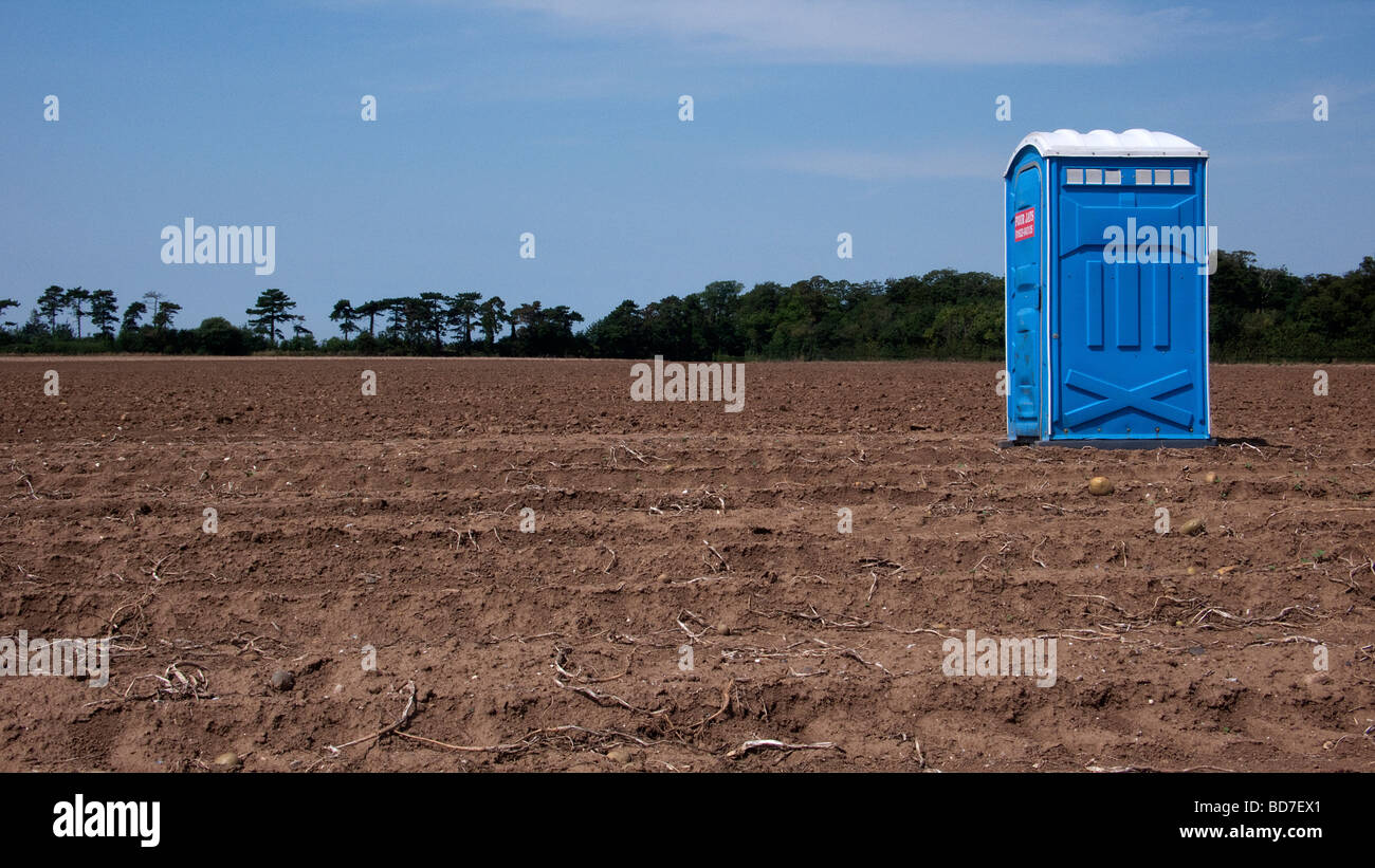 Portable toilet standing in rural field location Stock Photo - Alamy
