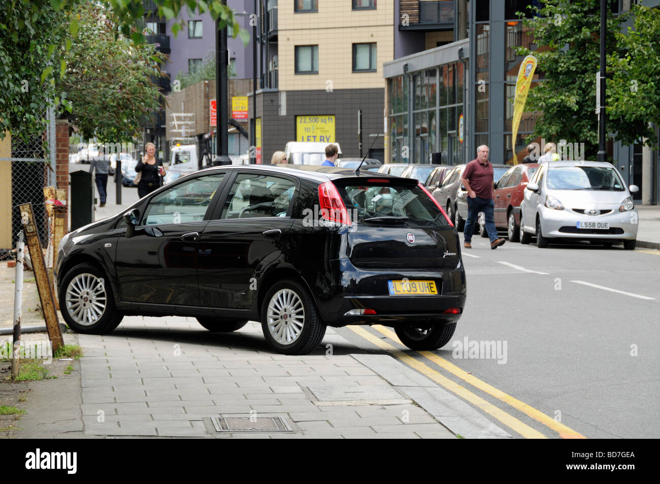 Car parked on pavement Holloway London England UK Stock Photo - Alamy