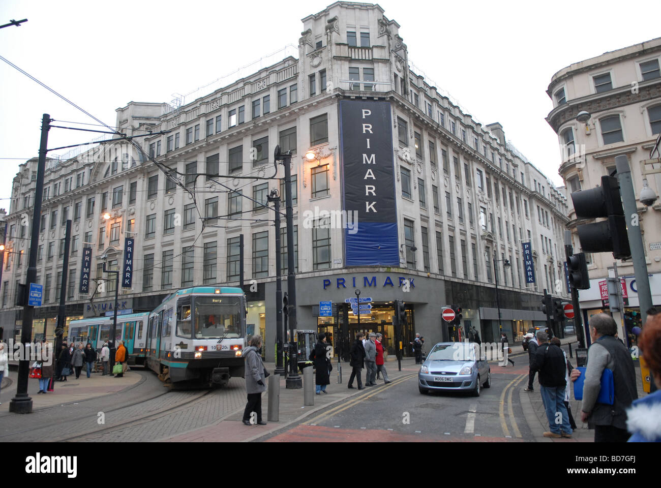 Metro running past PRIMARK store in Market Sreet Manchester Stock Photo ...