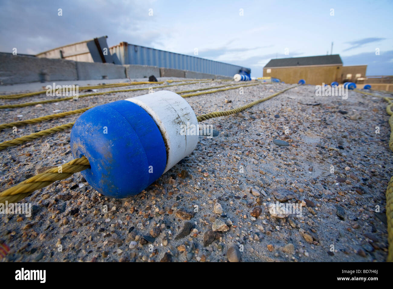 Plastic floats laid out waiting to be put in the water to create safe ...