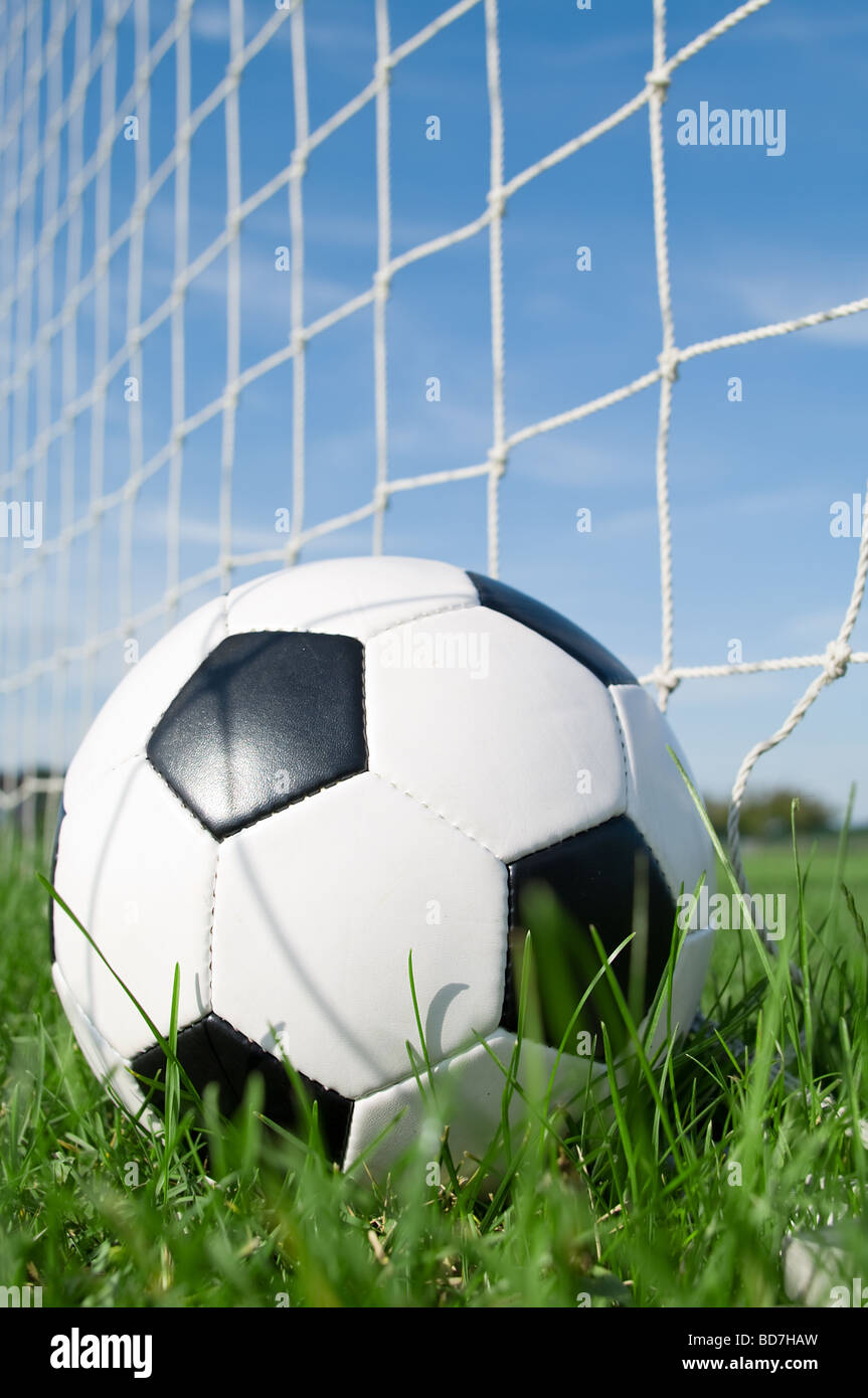 Soccer ball in the goal net Stock Photo - Alamy