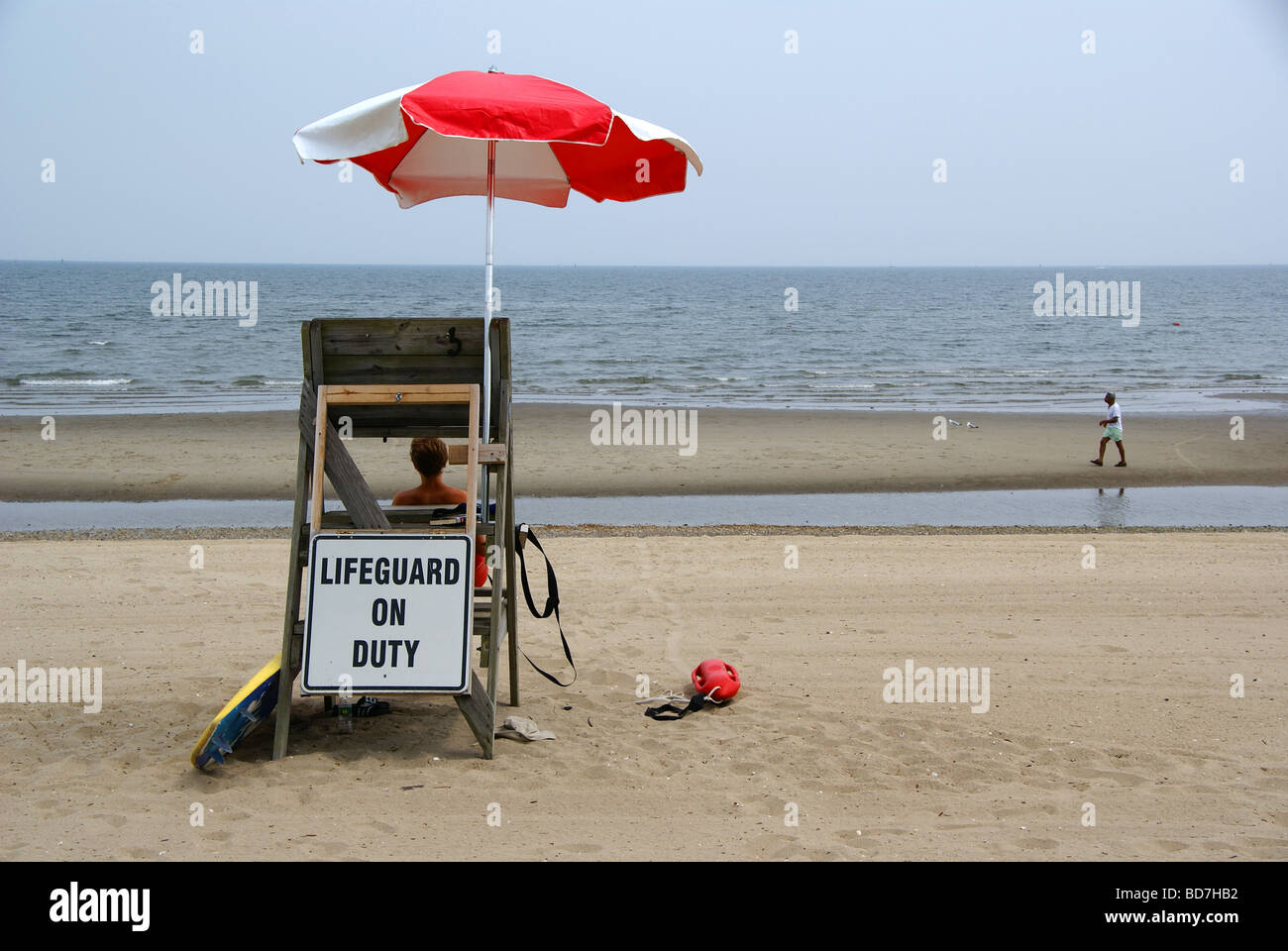 Lifeguard on duty watches ocean with no people swimming in it Stock ...