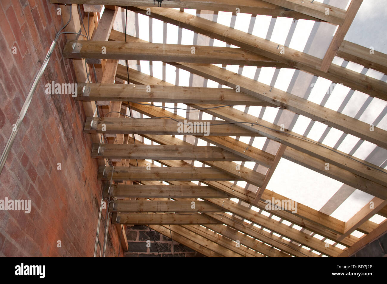 New roof rafters with felt on before tiles are fixed. looking from ...