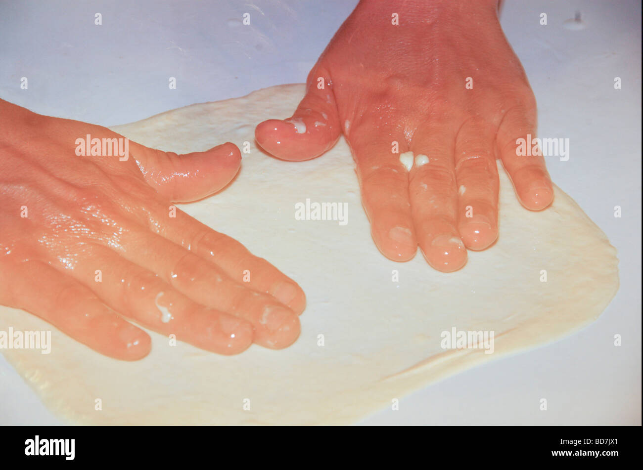 Spreading the dough of a Mofletta Stock Photo - Alamy