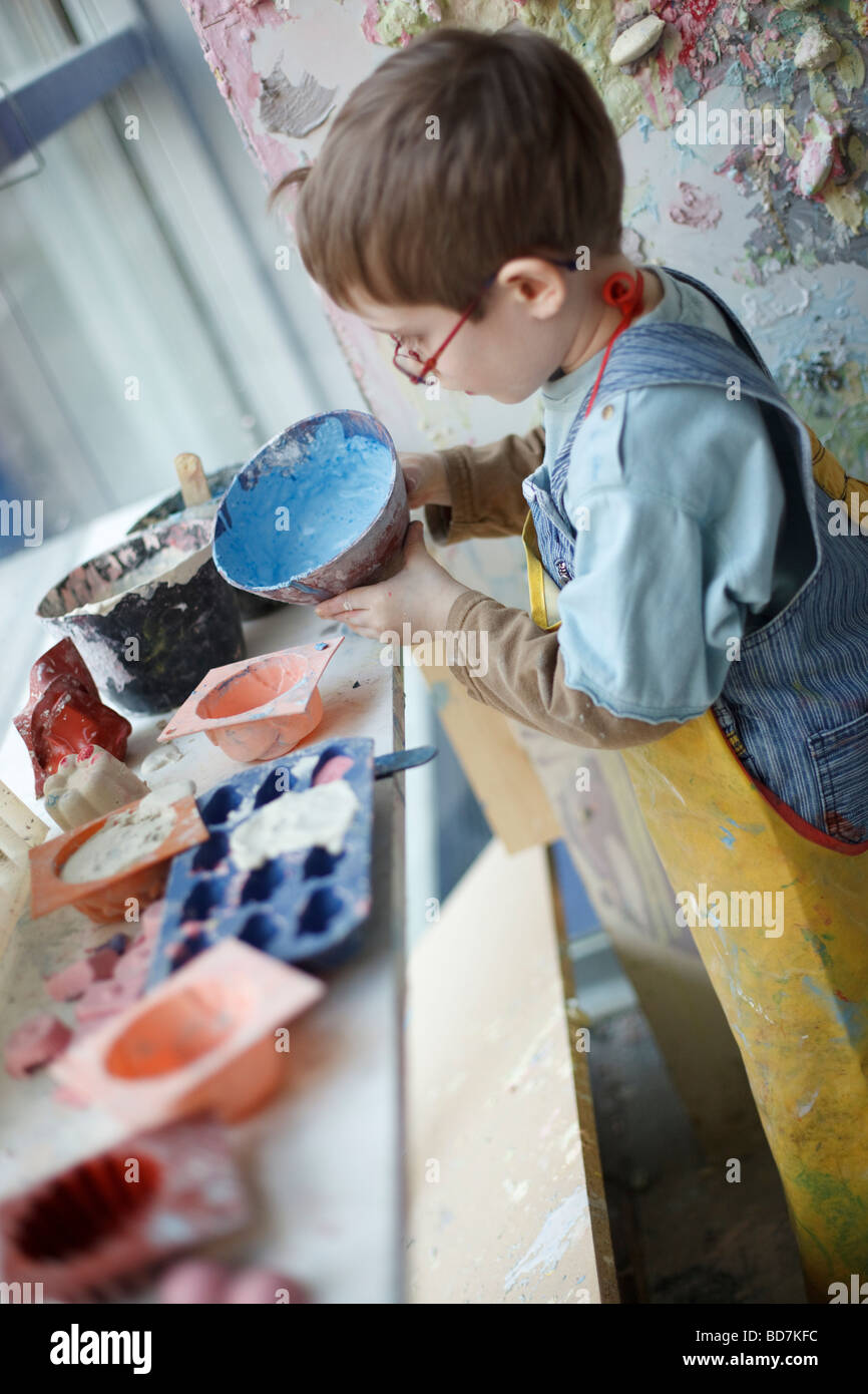 little boy working in studio Stock Photo - Alamy