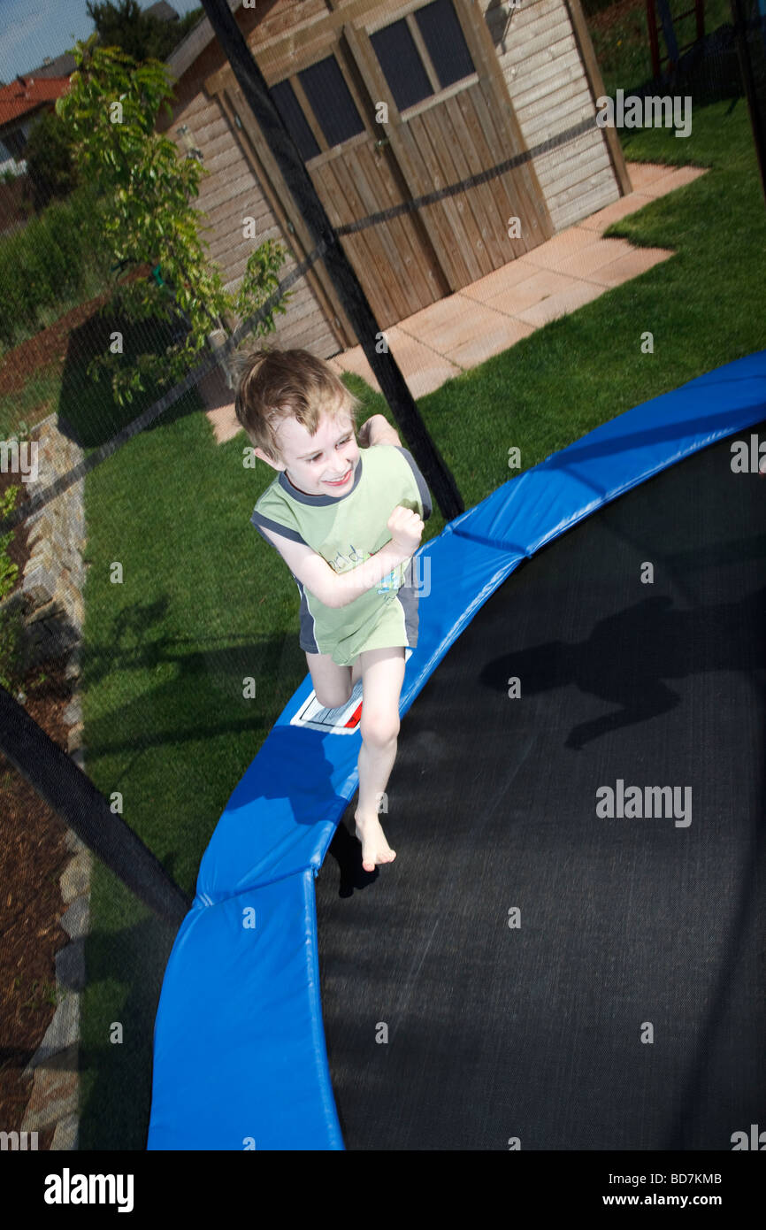 Children jumping on trampolines hi-res stock photography and images - Alamy