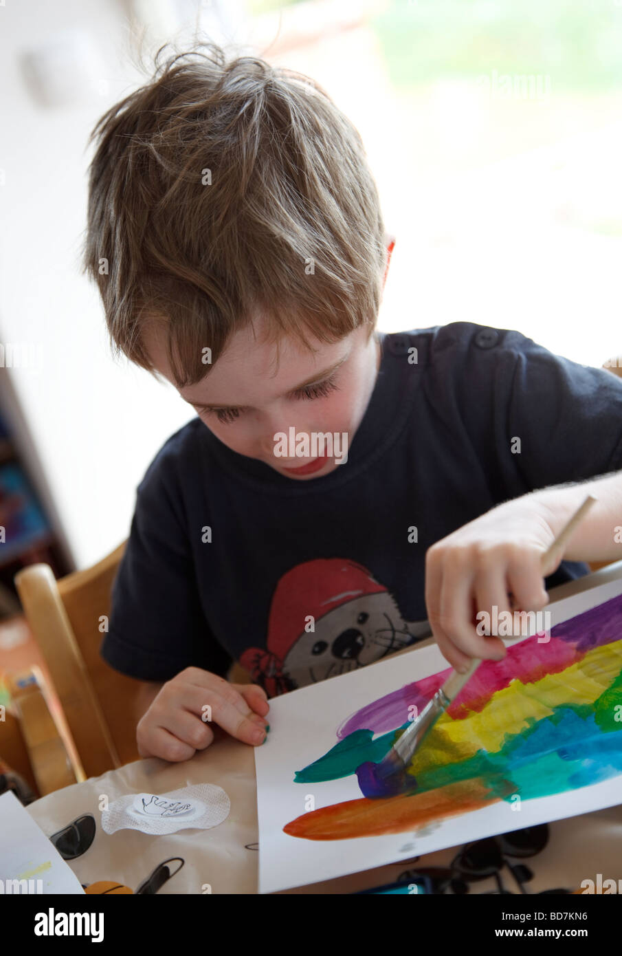 boy painting with watercolors Stock Photo - Alamy
