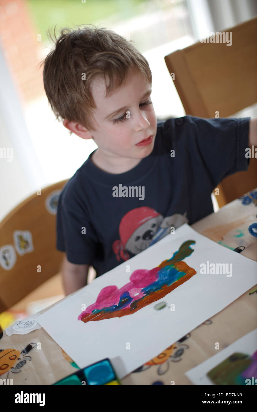 boy painting with watercolors Stock Photo - Alamy