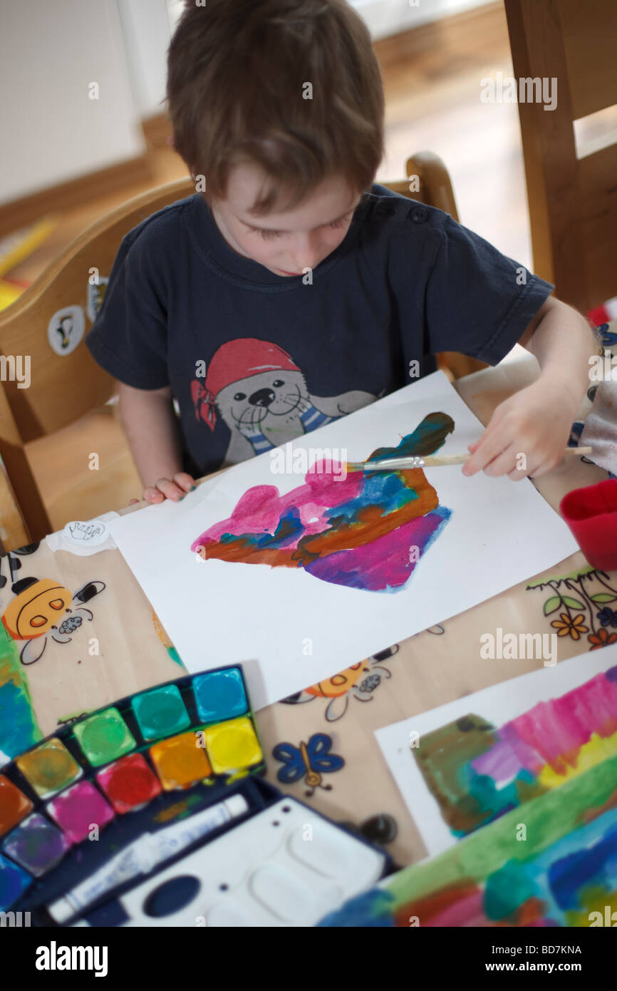 boy painting with watercolors Stock Photo - Alamy