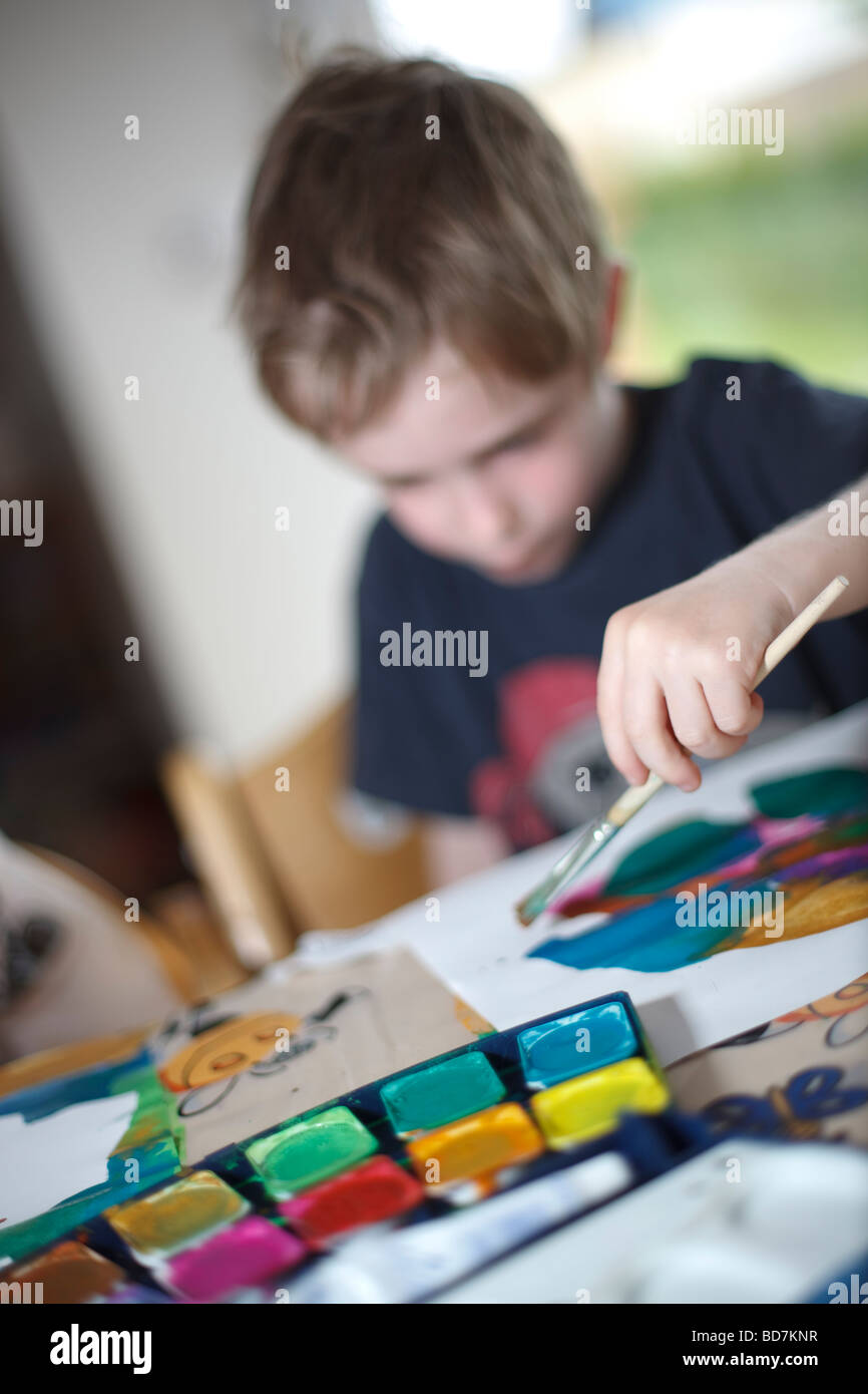 boy painting with watercolors Stock Photo - Alamy