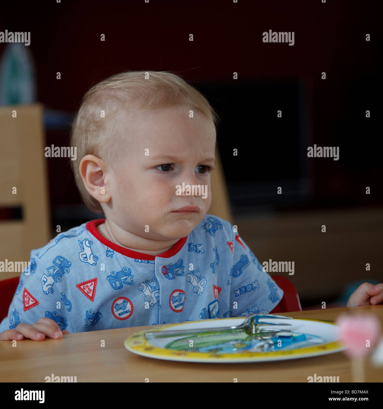 little boy with plate on table Stock Photo - Alamy
