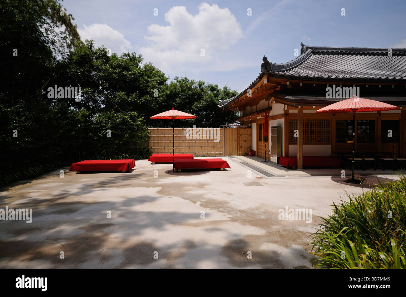 Sunny bar terrace with red parasols. Ginkaku-ji complex (Temple of ...