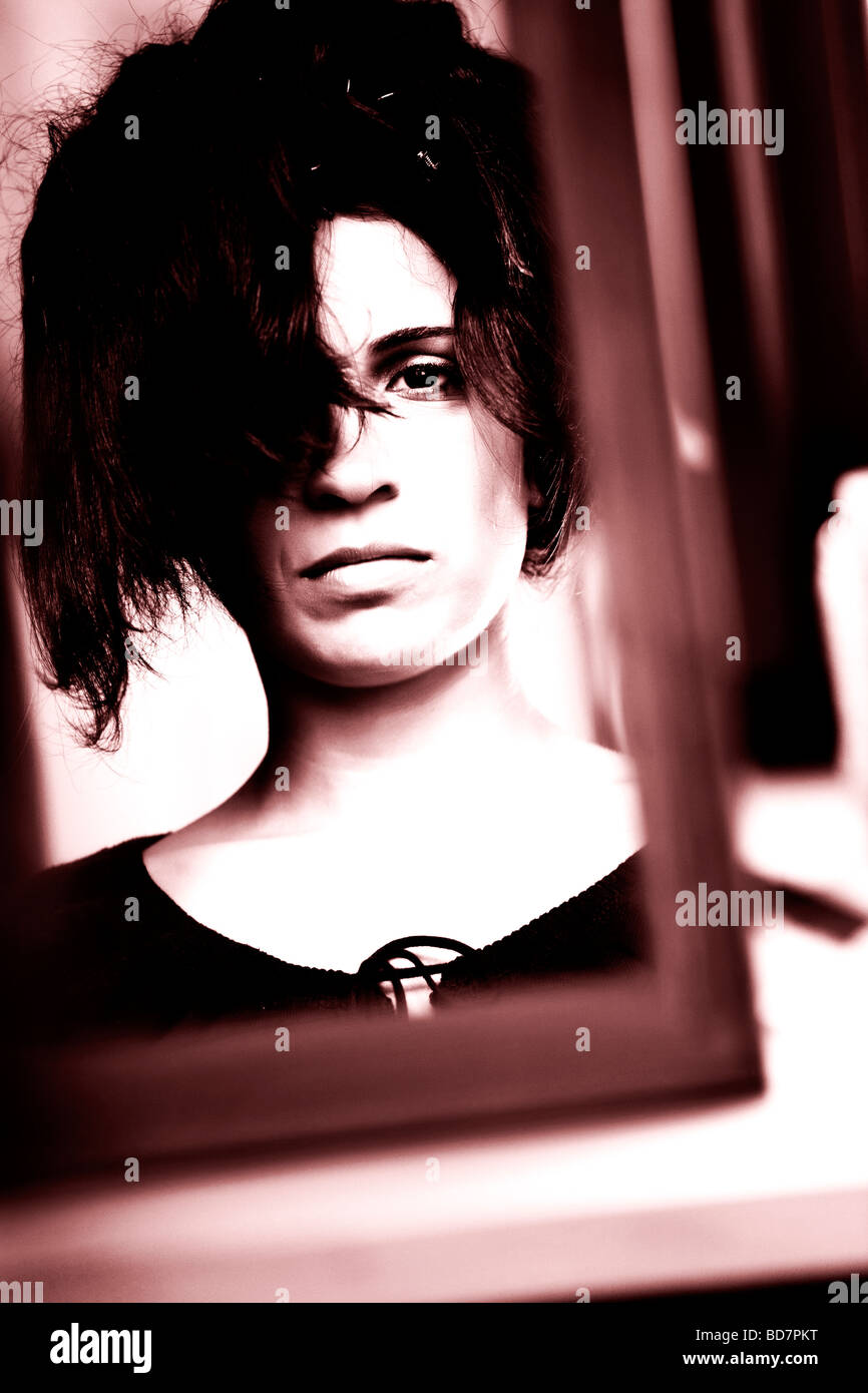 young woman seeing herself in the mirror Stock Photo - Alamy