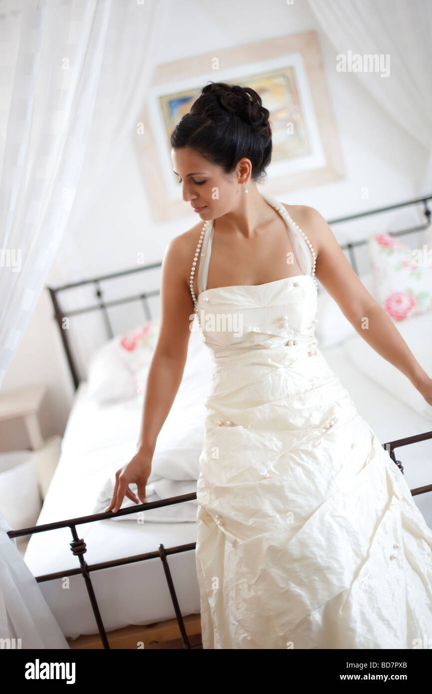 bride leaning on bed Stock Photo - Alamy