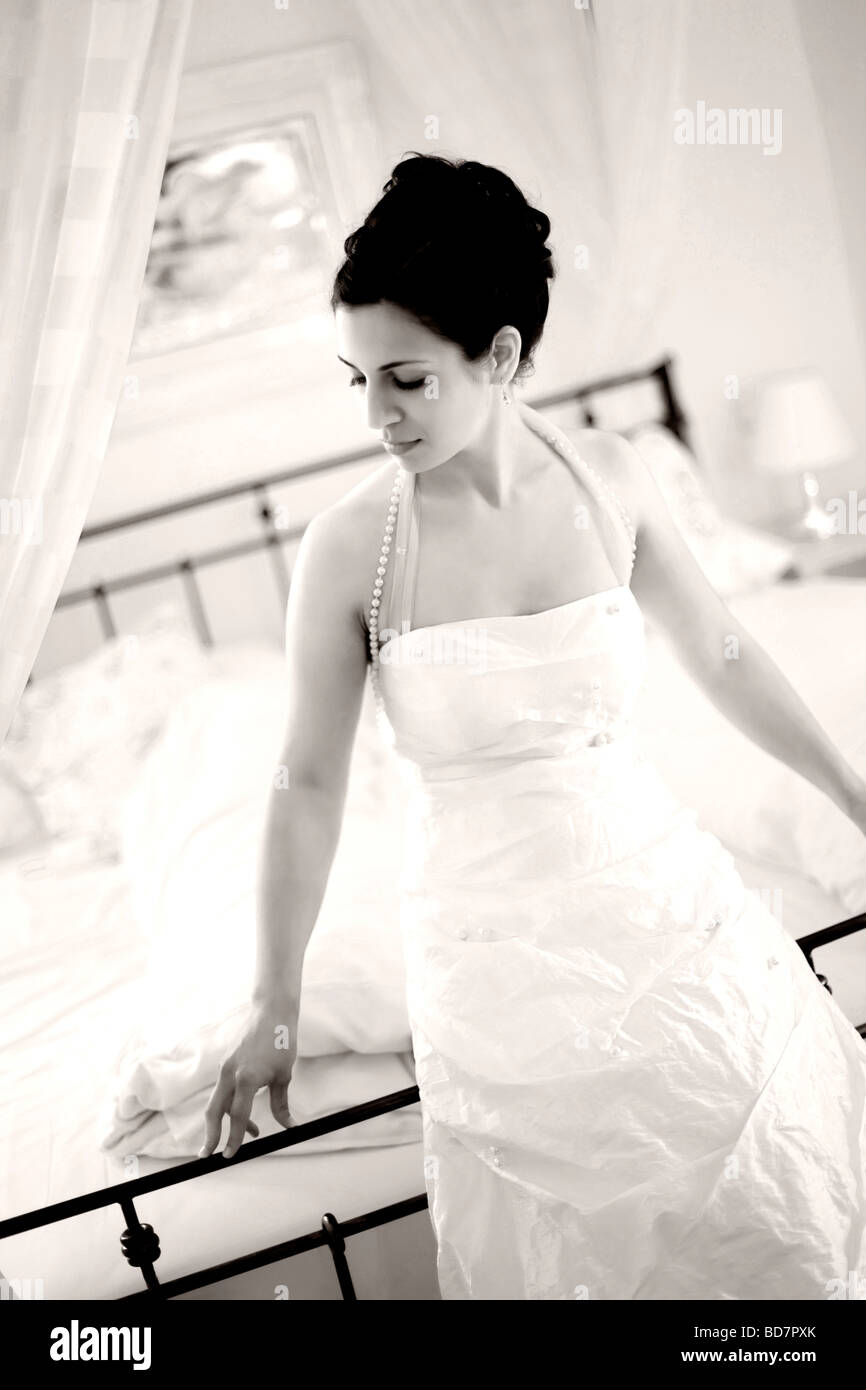 bride leaning on bed Stock Photo - Alamy